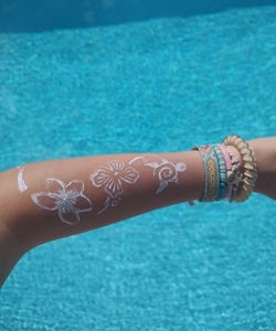18 Sunscreen Tattoo Ideas: Tanning a Design Onto Your Skin - TattoosOfAsia