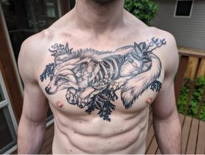 18 Bold and Powerful Chest Tattoos for Men with Meaning - TattoosOfAsia